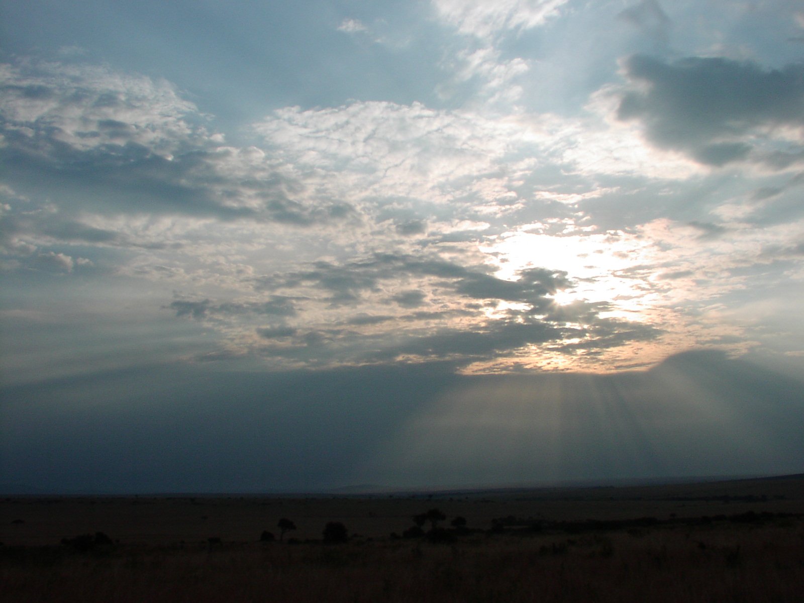 Sun hiding behind clouds - Photopublicdomain.com